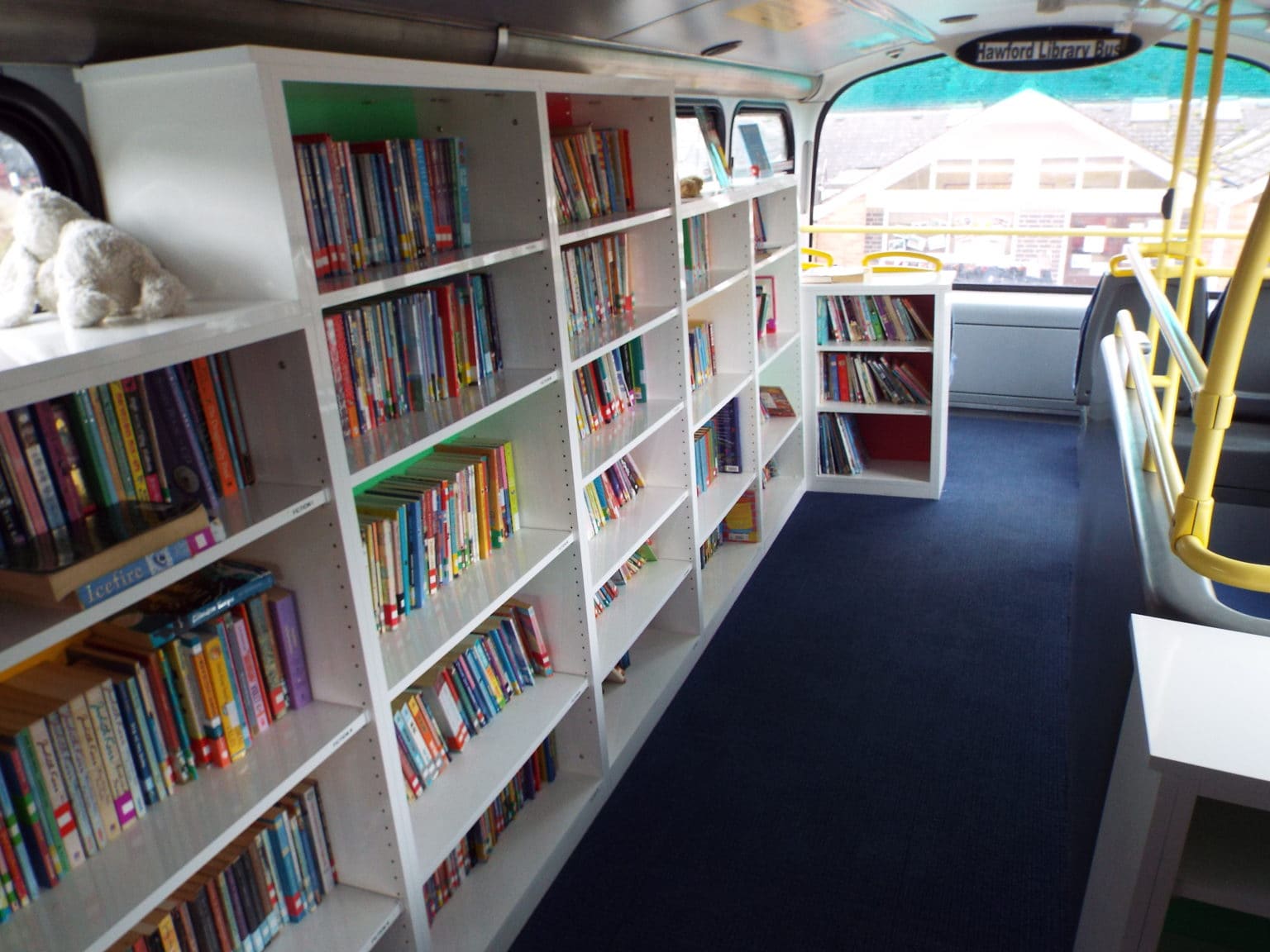 Kings Hawford celebrate opening of double decker bus library - Witley Jones